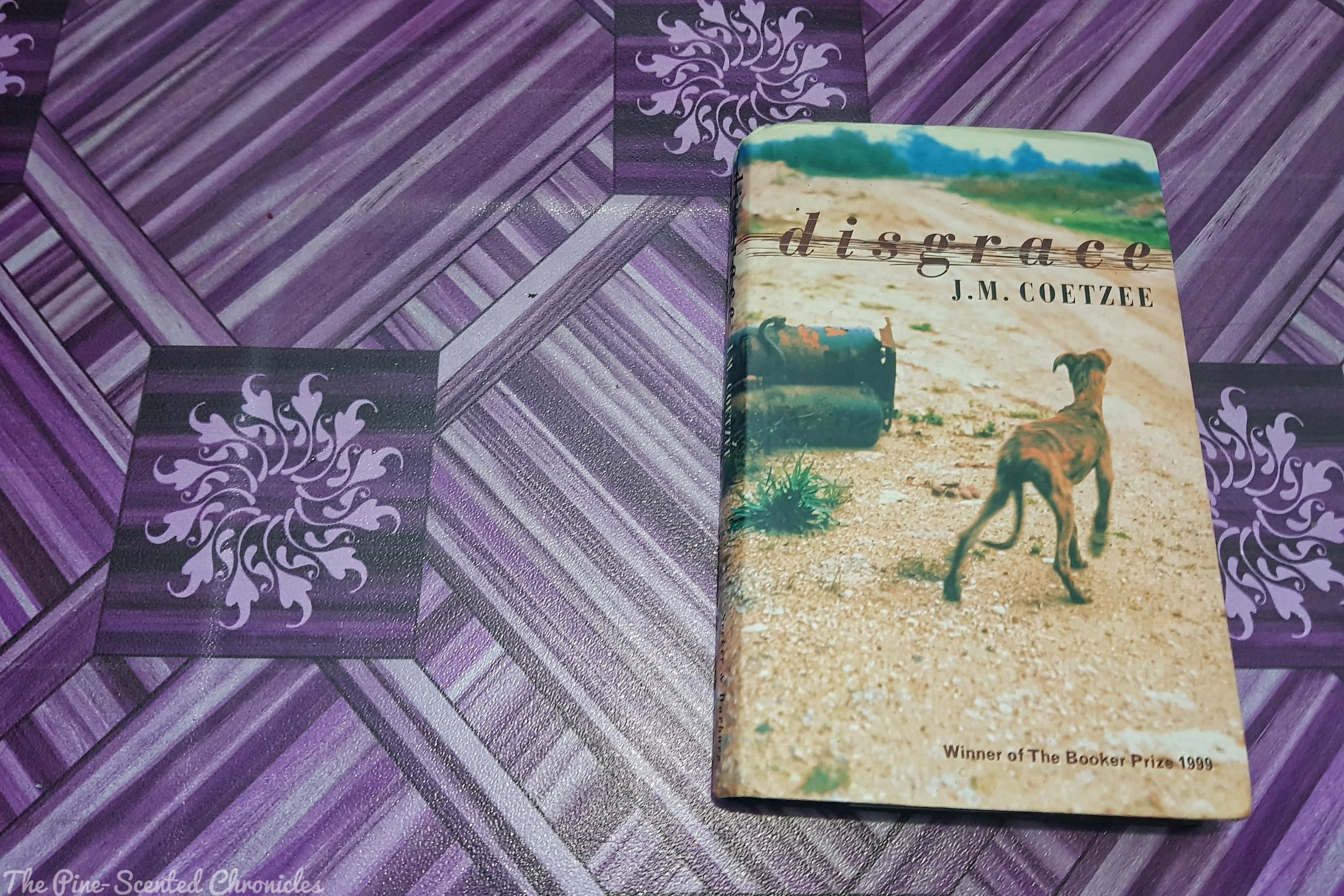 Book Review # 87: Disgrace – The Pine-Scented Chronicles
